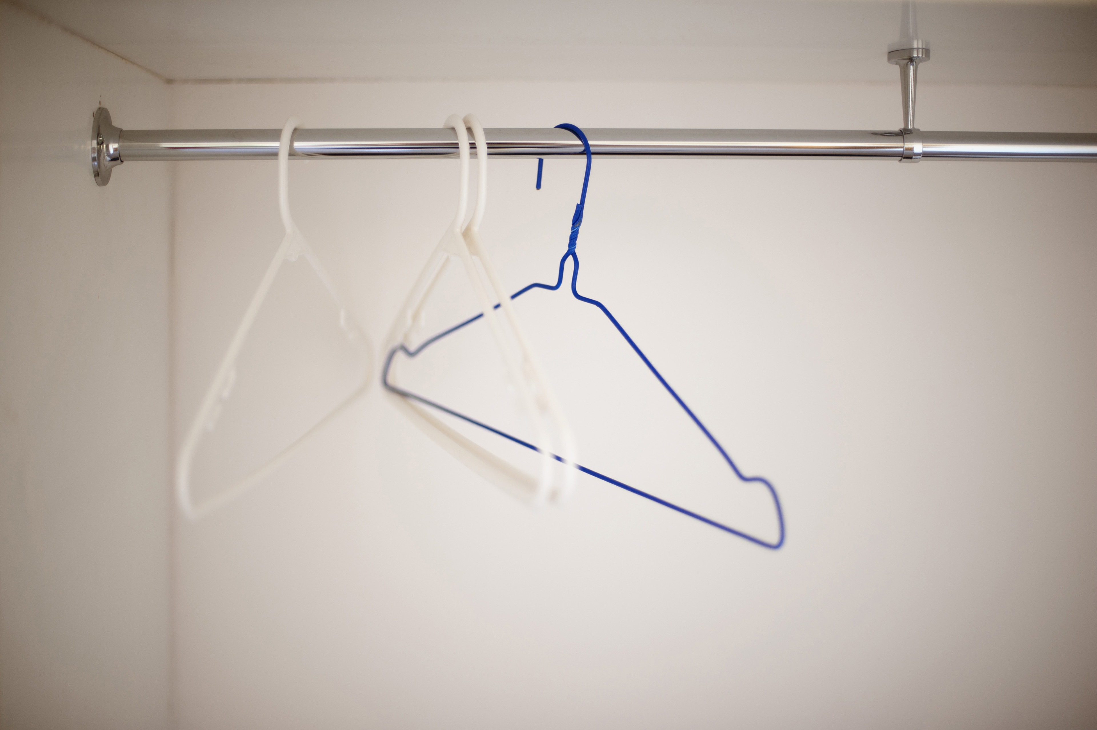 Free Image Of Wire Coat Hangers On A Clothing Rail Freebie Photography